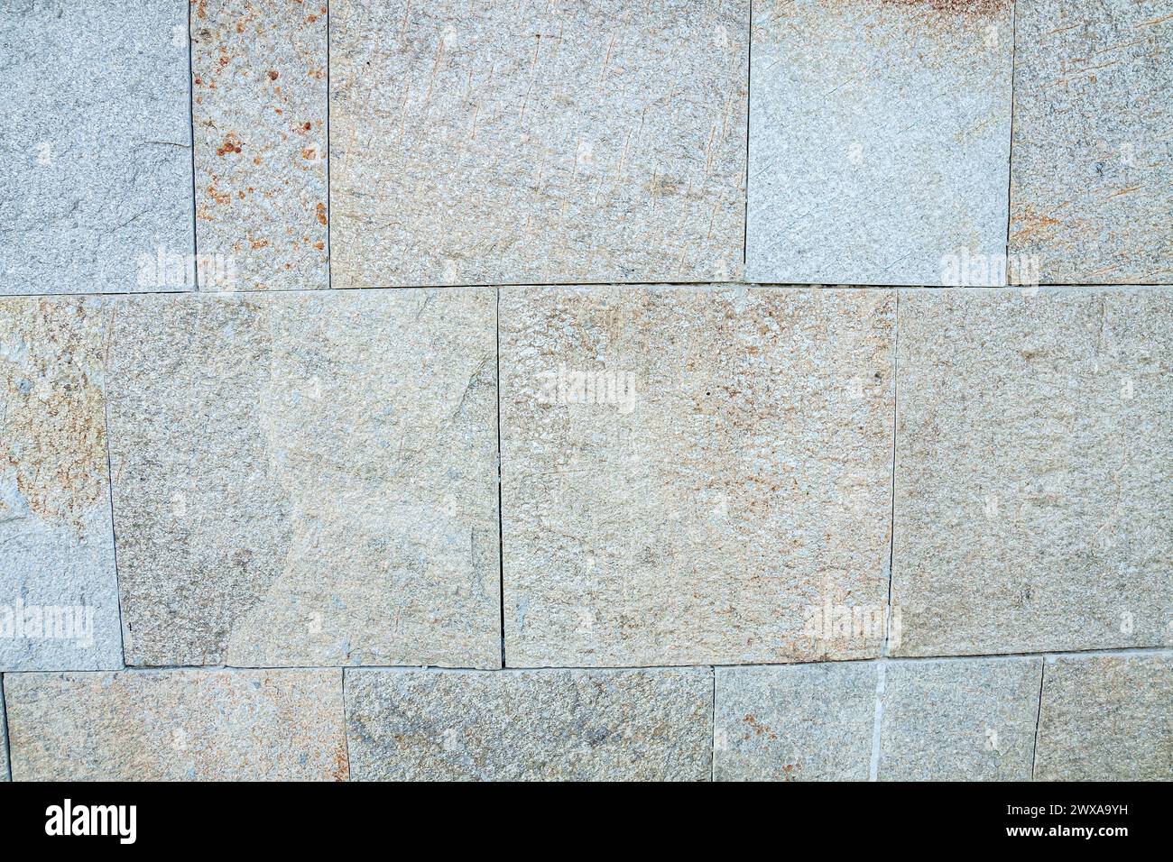 Wall cladding of horizontally arranged stones. Selective focus with ...