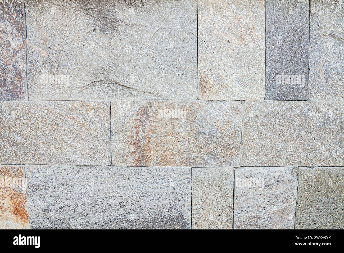 Wall cladding of horizontally arranged stones. Selective focus with ...