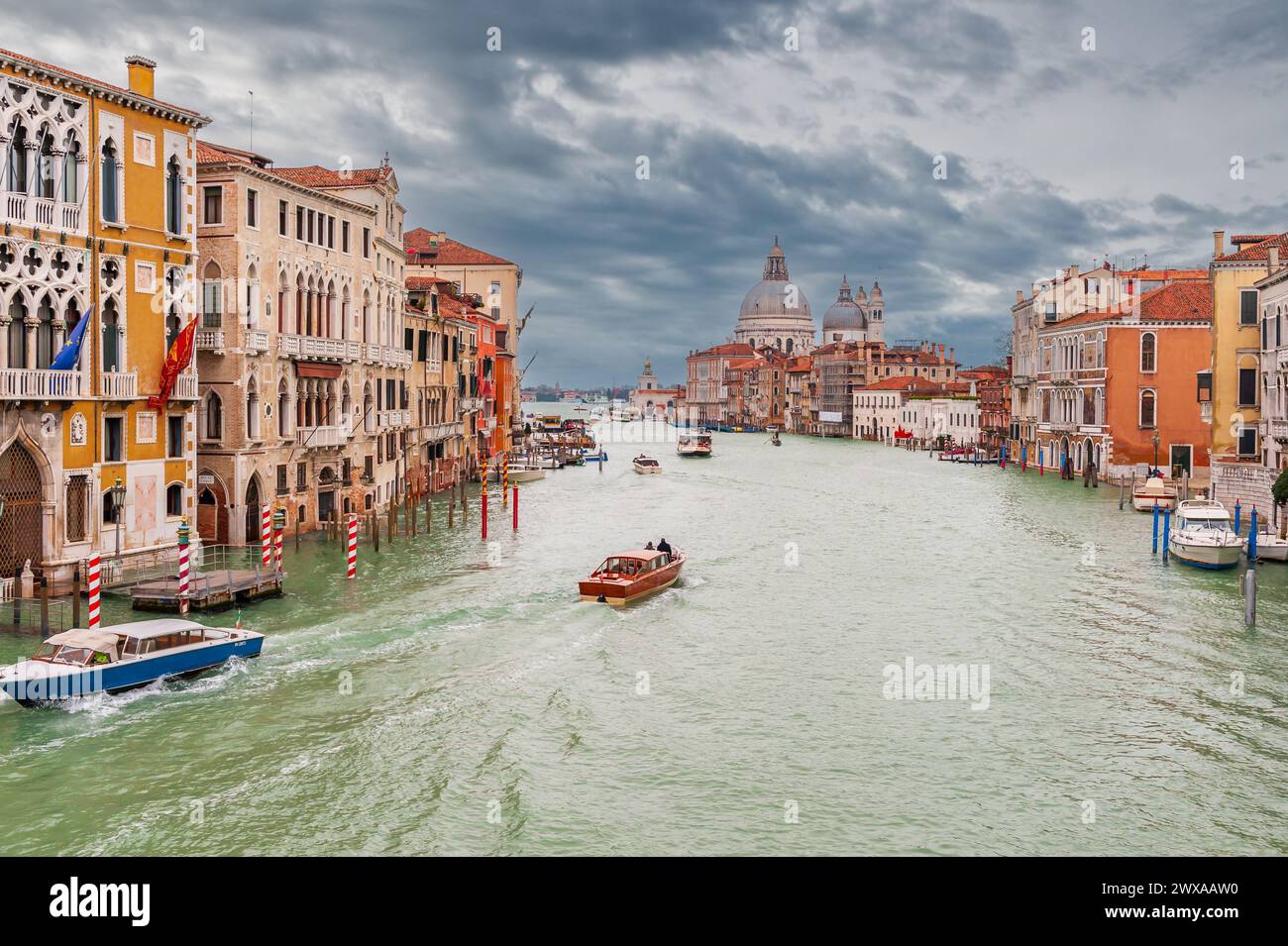 The Grand Canal and Santa Maria della Salute below under a colorful sky ...
