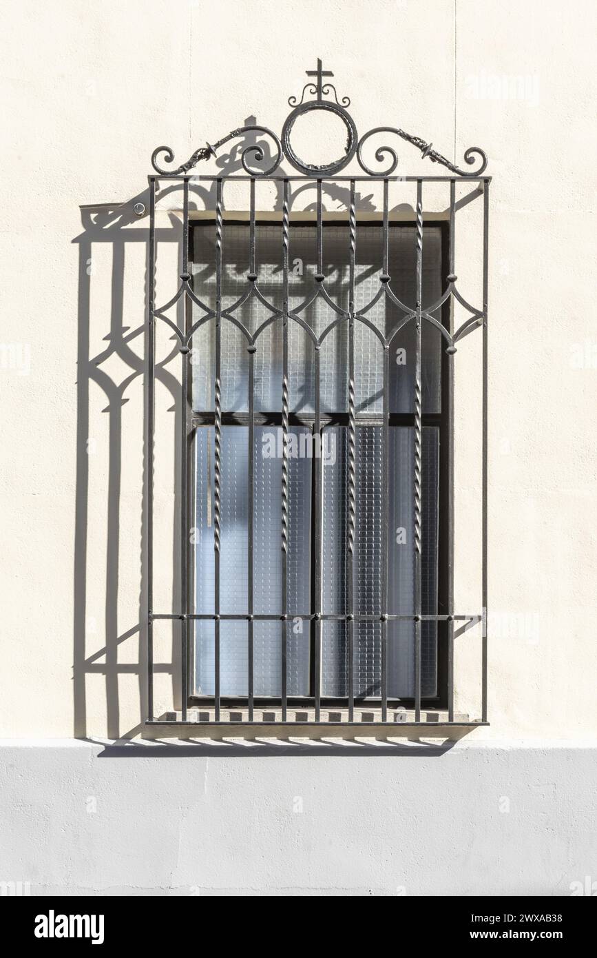 Small window of a church with black metal wrought iron bars Stock Photo ...