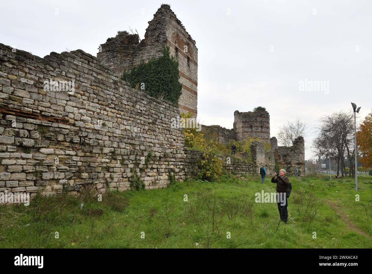 Istanbul, Turkey - Dec 12, 2023:. Tourist near old ruins Walls of ...