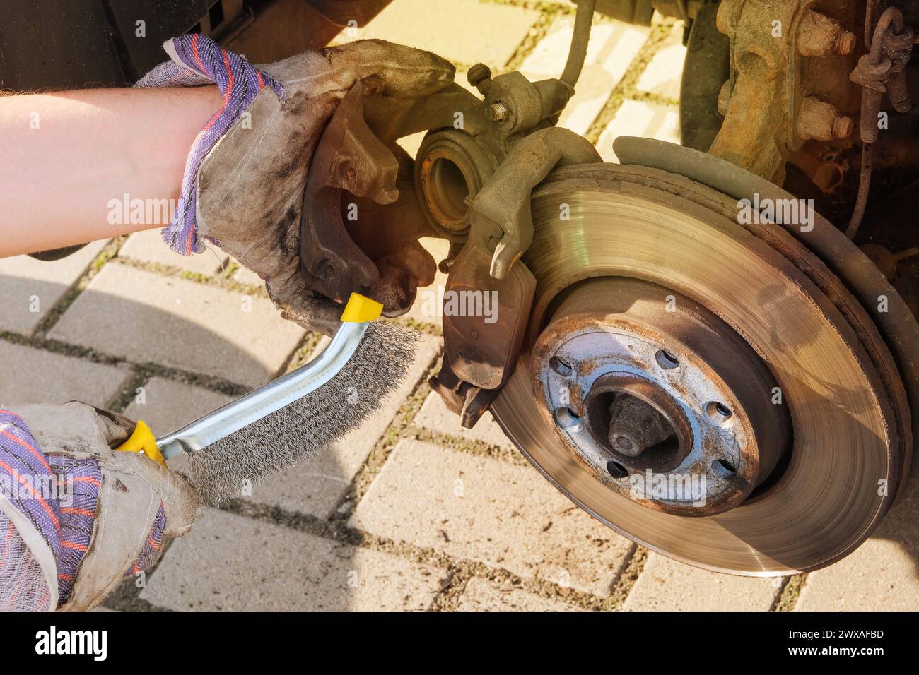Car repair concept. Car mechanic using different repair tools for ...