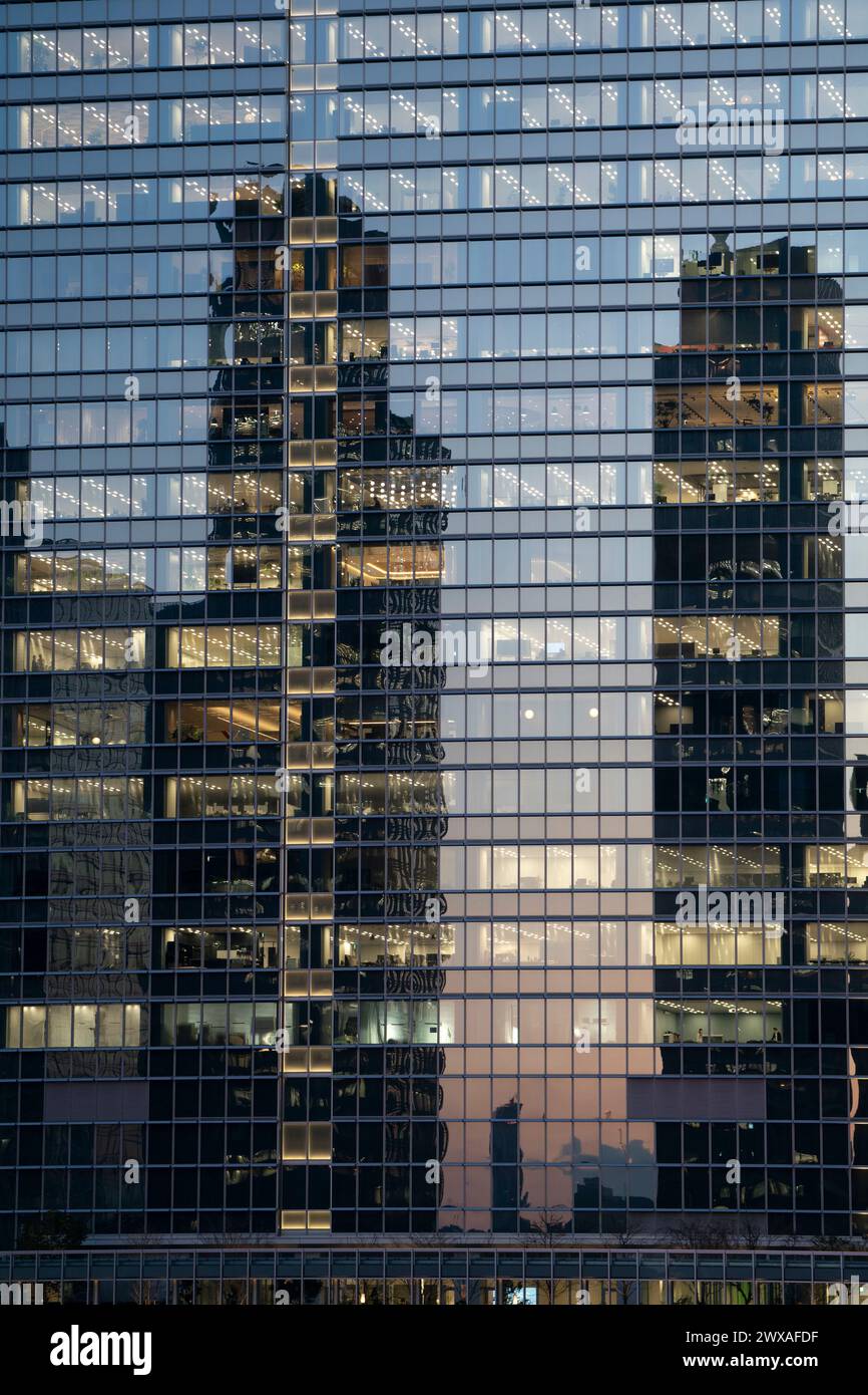 Tokyo, Japan, 29 March 2024. The sunset sky and two office blocks ...