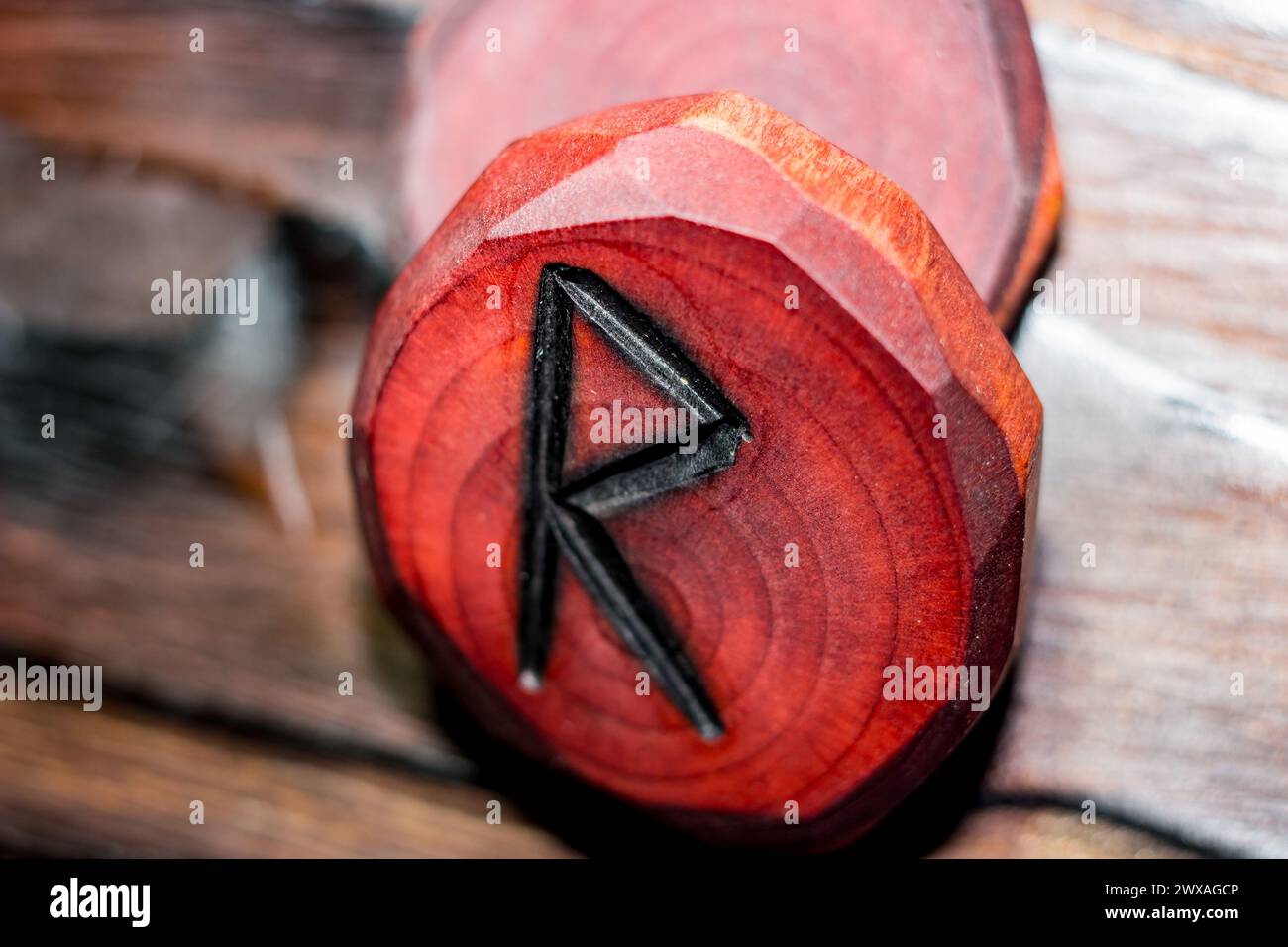 Rune Raido red color carved from wood on a wooden background - Elder ...