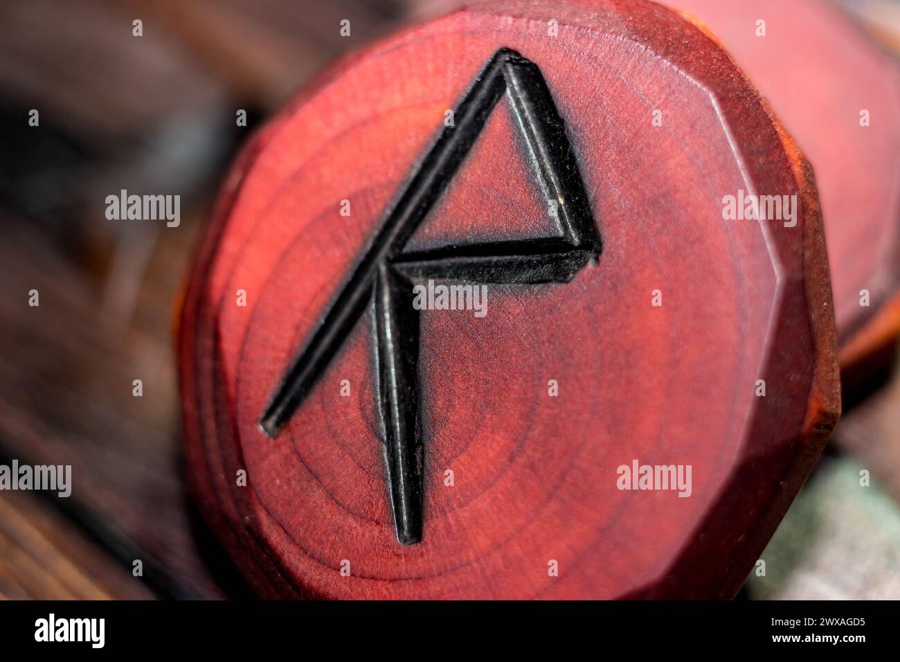 Rune Raido red color carved from wood on a wooden background - Elder ...