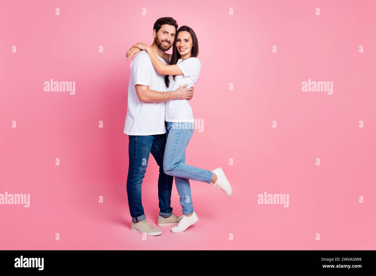 Full body photo of nice young couple hugging care each other dressed ...