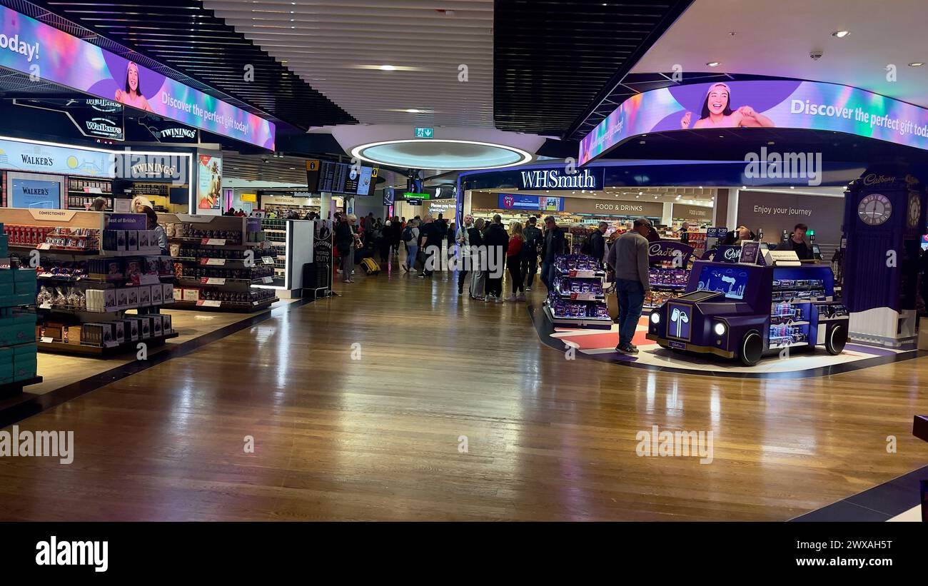 London,UK:March 26,2024: Travelers shopping at Duty free shops at ...