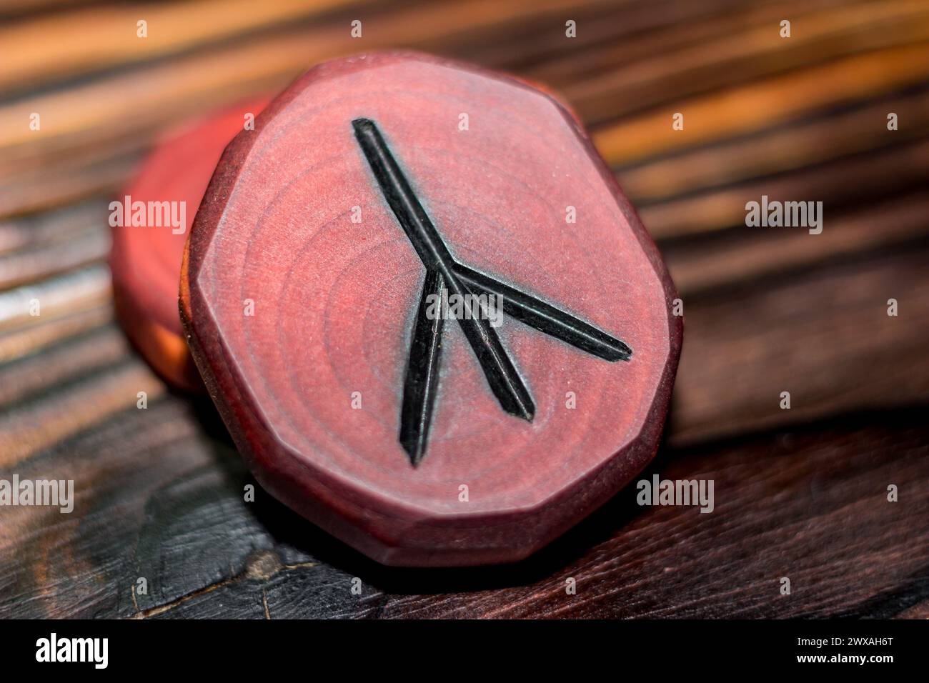Inverted runes Algiz (Elhaz) - symbol of death, carved from wood on a ...