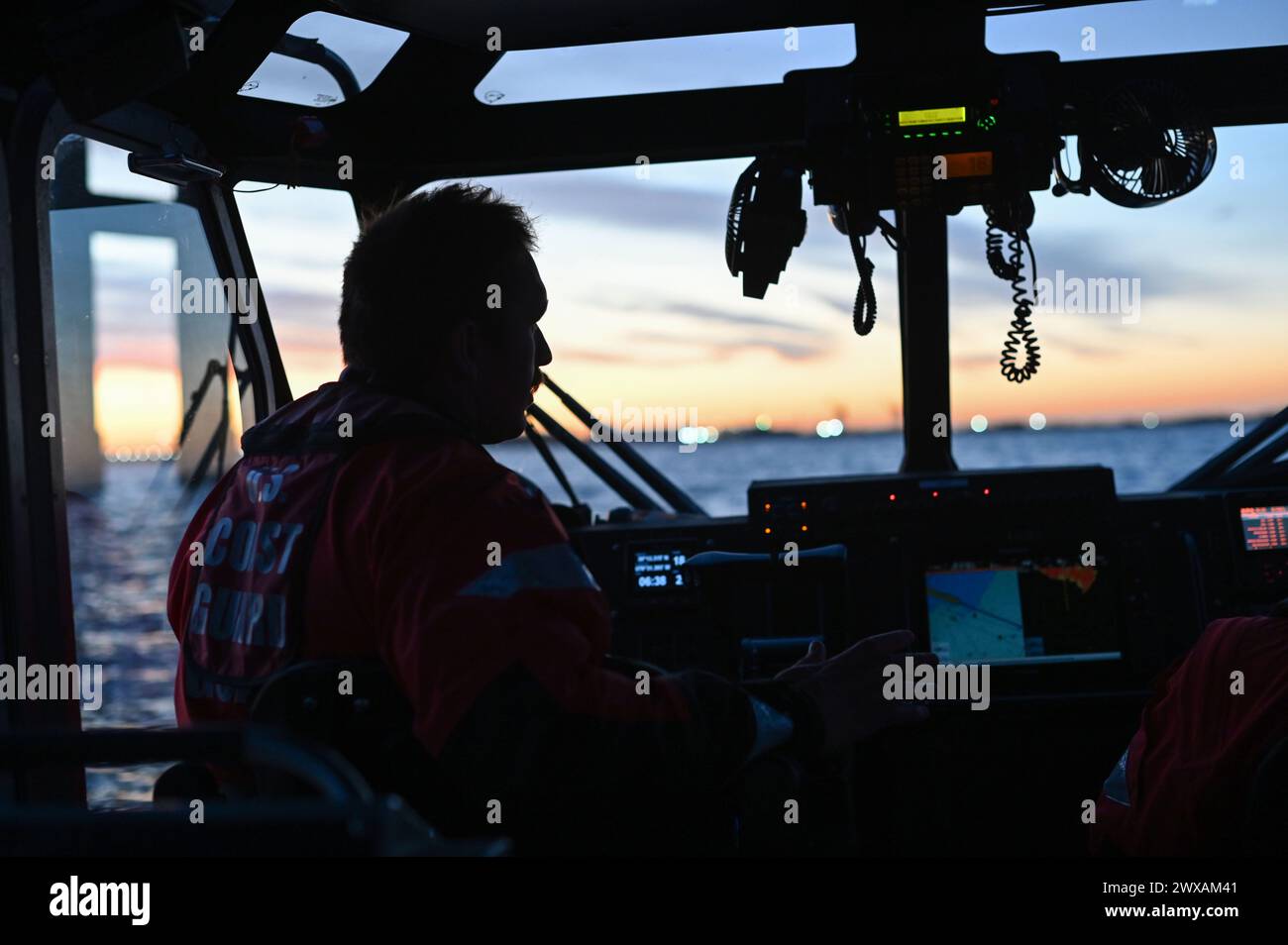 U.S. Coast Guard response boat crews arrive on scene after the collapse ...