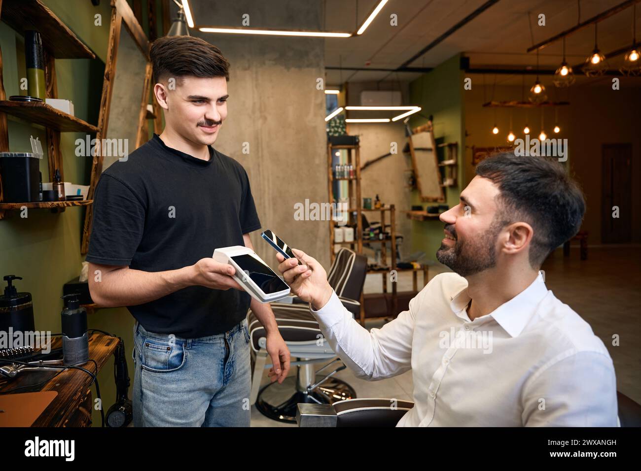 Client paying in barbershop hi-res stock photography and images - Alamy