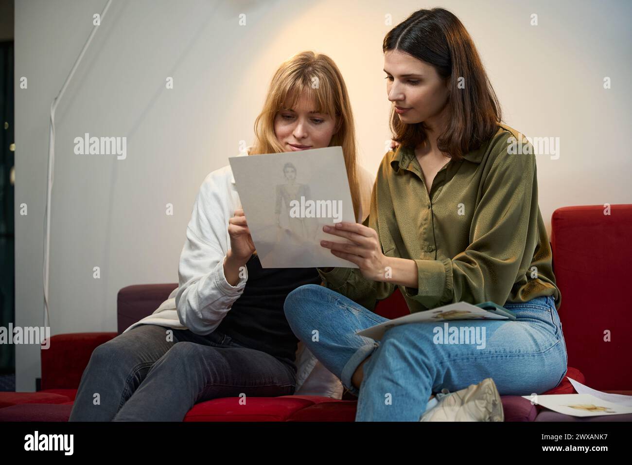 Fashion professionals in coworking environment sharing ideas of ...