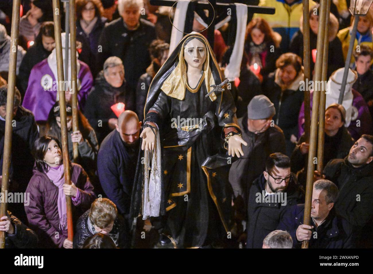 A statue of the Our Lady of Sorrows is taken in a procession, in ...