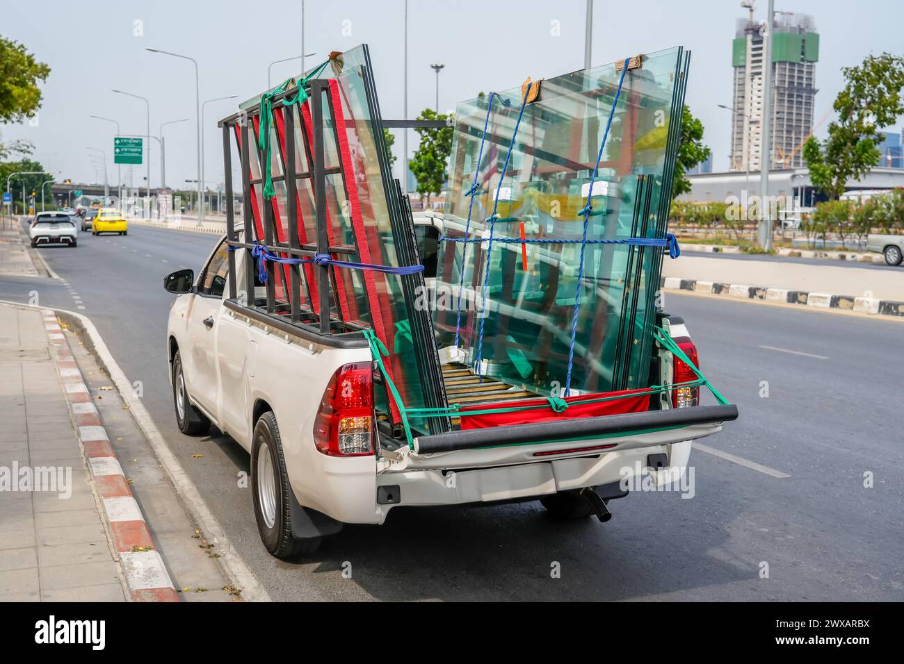 Glass sheets for a showcase window loaded into the back of a truck, for ...