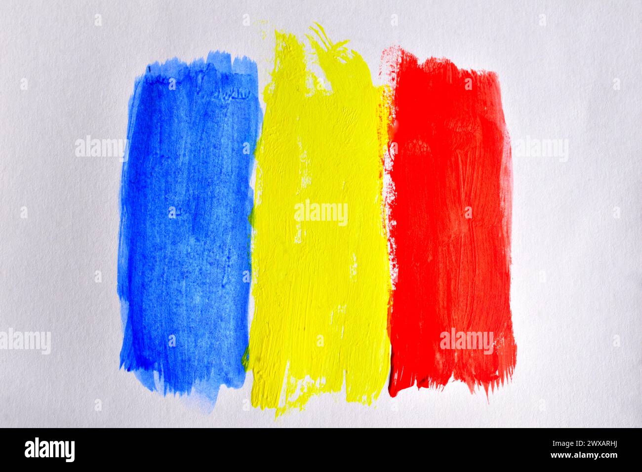 On a white sheet, vertical lines were drawn with watercolors that look ...