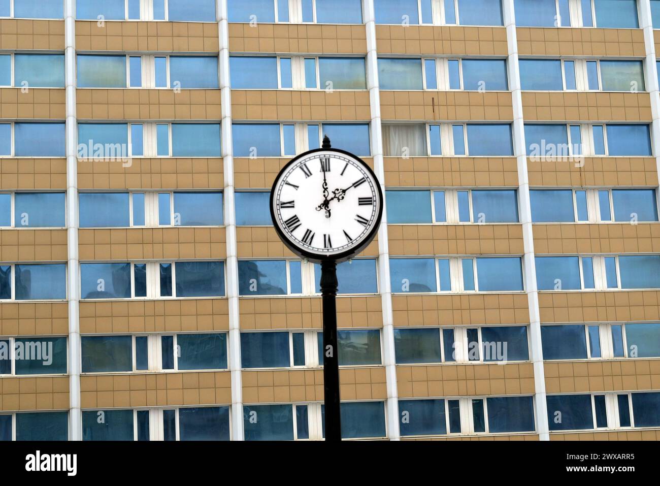Modern clocks are installed on one of the city squares to provide ...