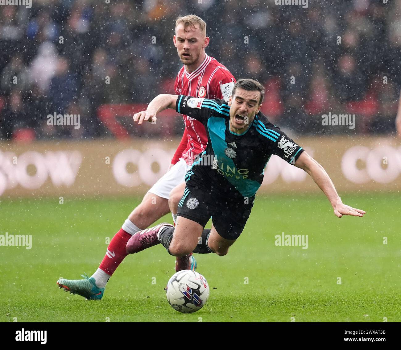 Bristol City's Mark Sykes (left) tackles Leicester City's Harry Winks ...
