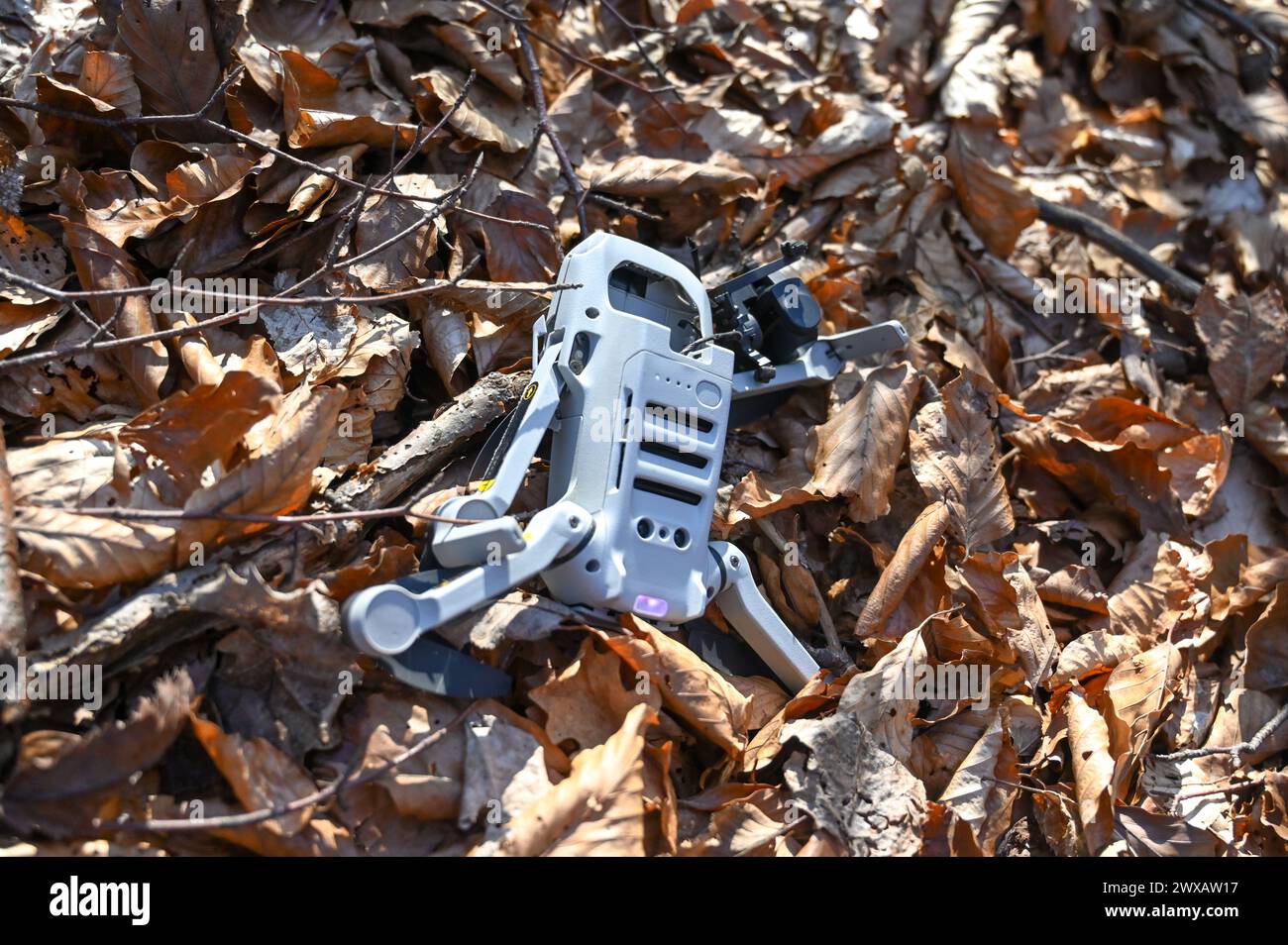 Crashed and damaged drone. Broken arms and camera gimbal of drone in ...