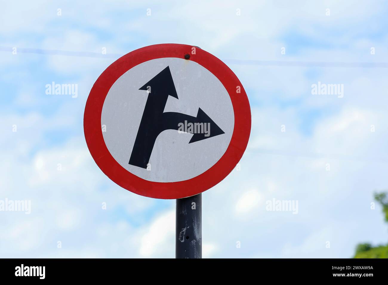 white traffic sign indicating direction ahead and right - go in two ...