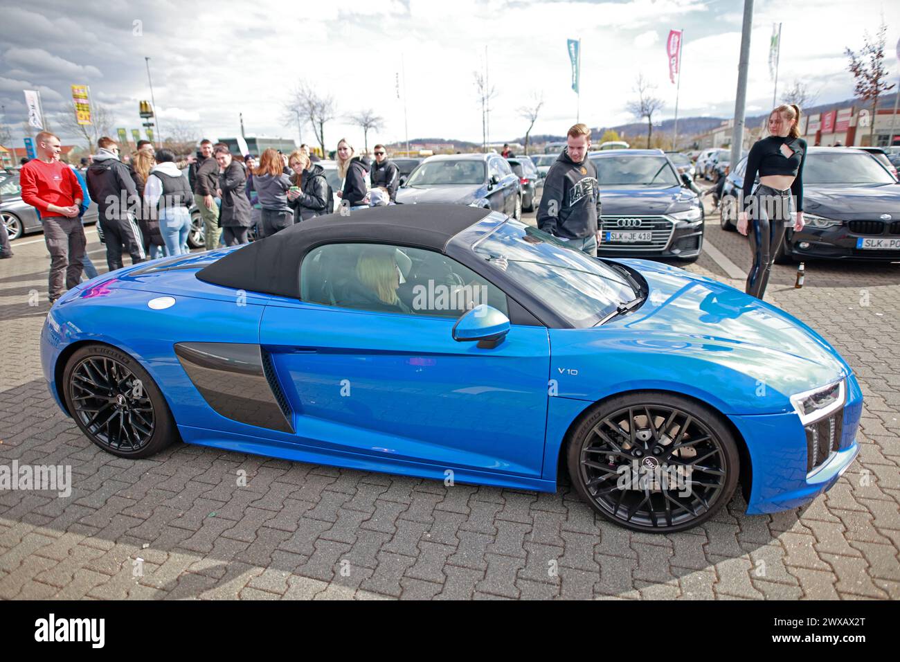 Blankenburg, Germany. 29th Mar, 2024. Fans of the tuning scene stand ...