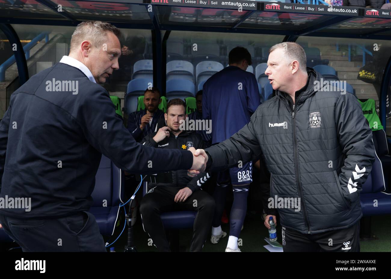 Huddersfield Town manager Andre Breitenreiter (left) and Coventry City ...