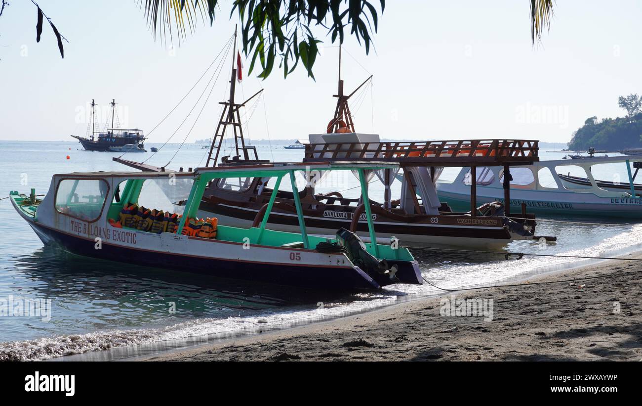 Some boats belonging to Lombok residents are leaning on the beach. This ...