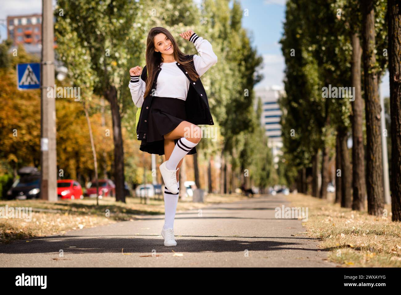 Full size photo of satisfied student dressed jacket skirt long socks ...