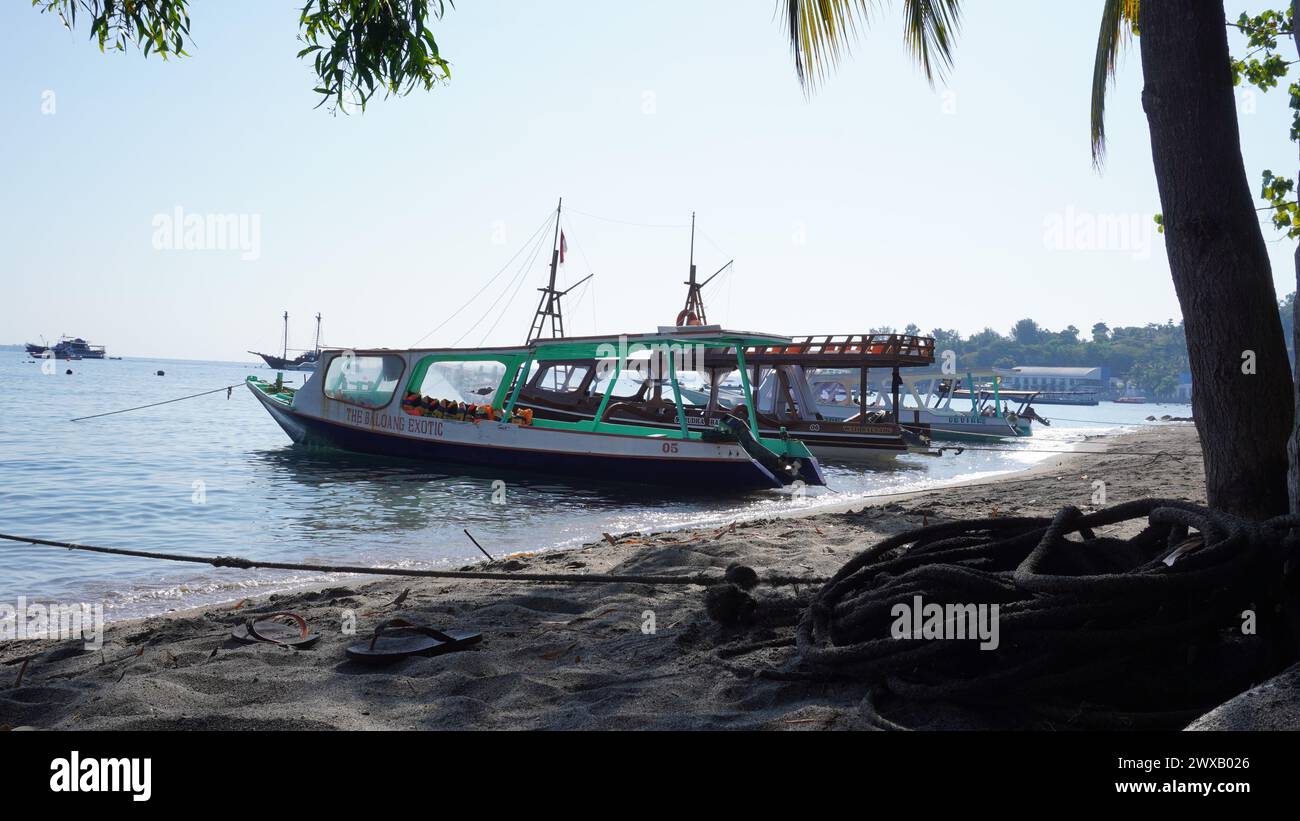 Some boats belonging to Lombok residents are leaning on the beach. This ...