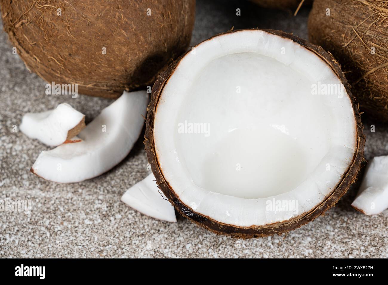 Coconut milk in half a coconut Stock Photo - Alamy