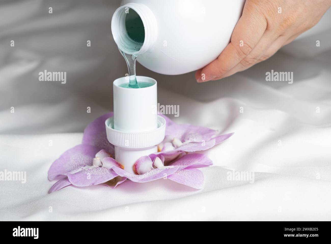 The process of pouring natural eco gel liquid laundry detergent from ...