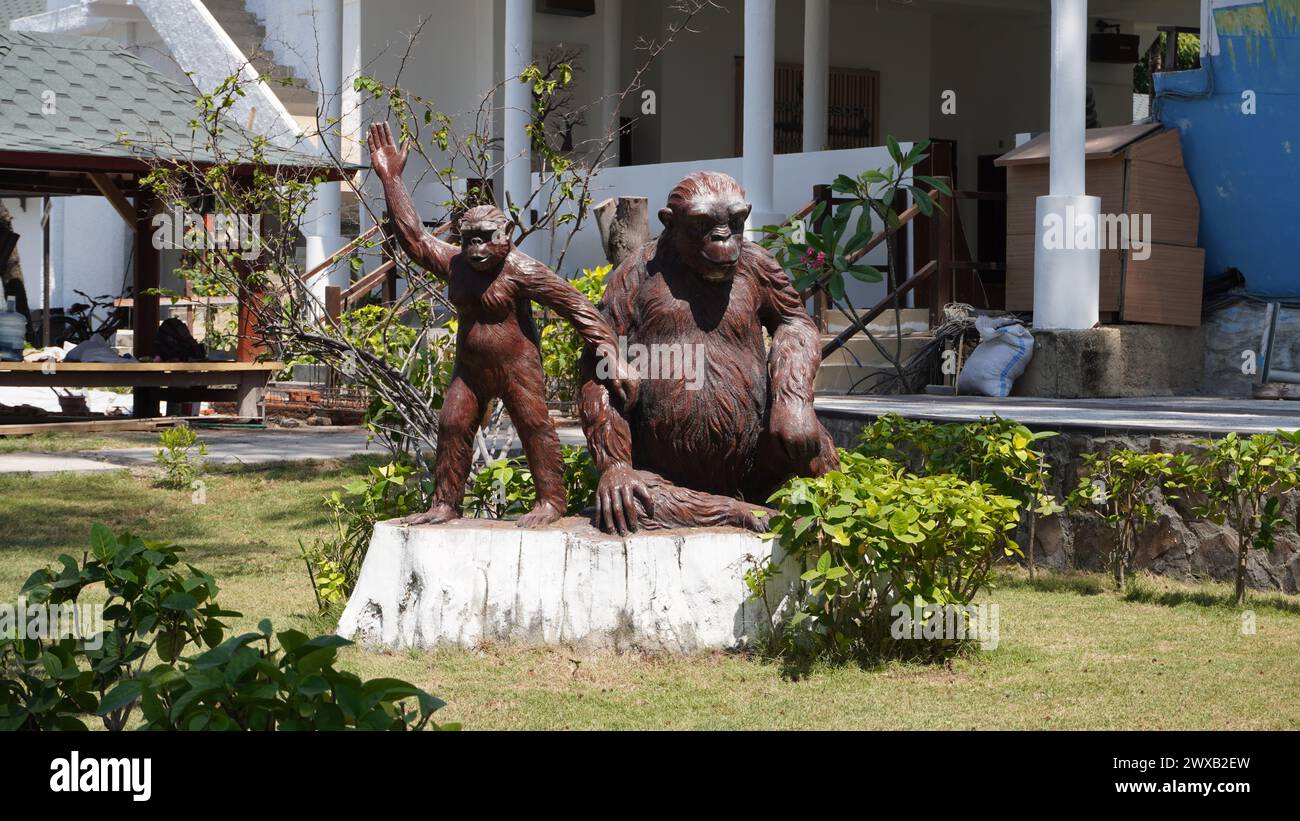 Statue of two brown monkeys Gili Trawangan in Lombok which is at the ...