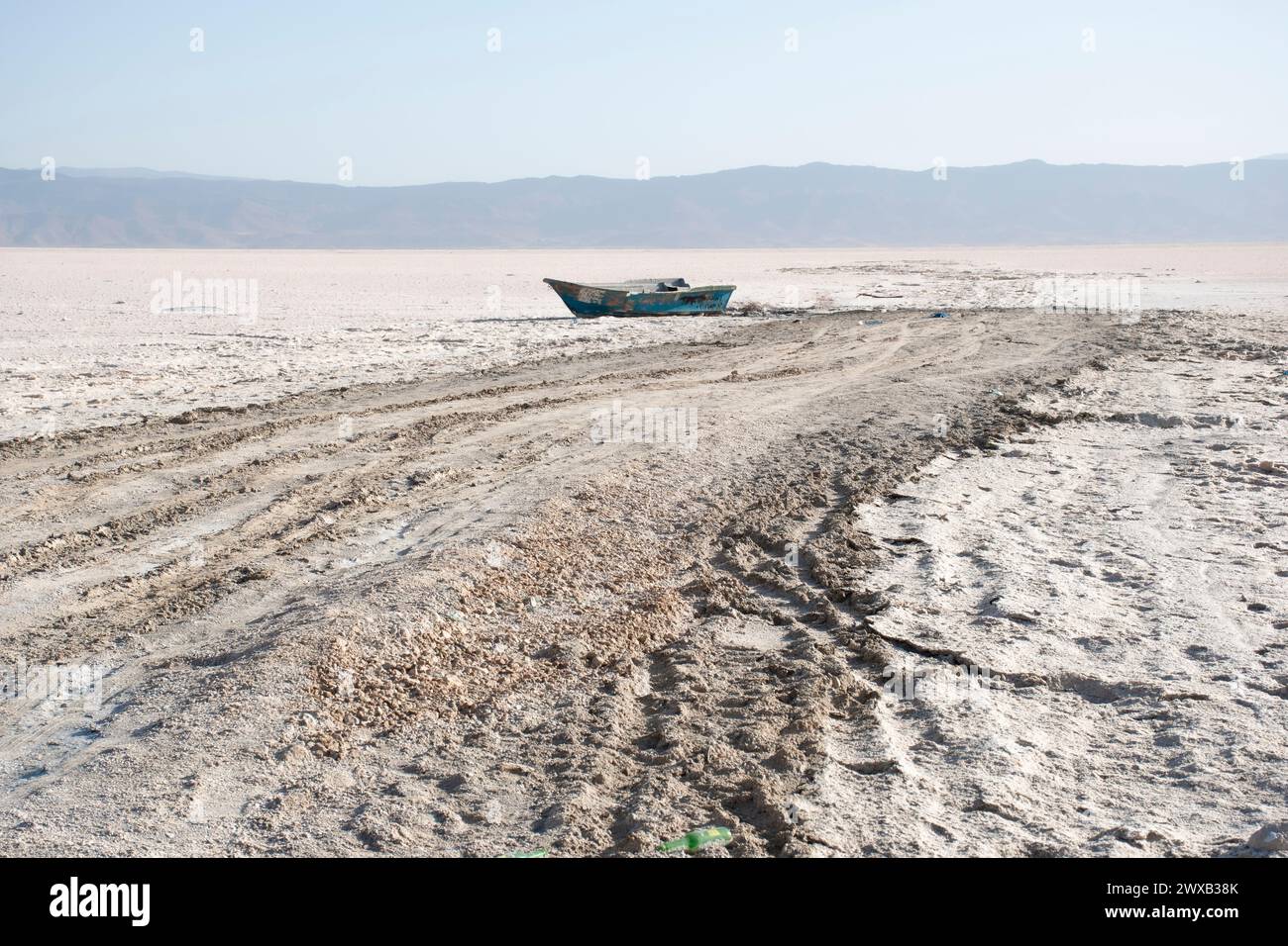Dried up salt lake in summer and pink salt pools in Maharlu region near ...