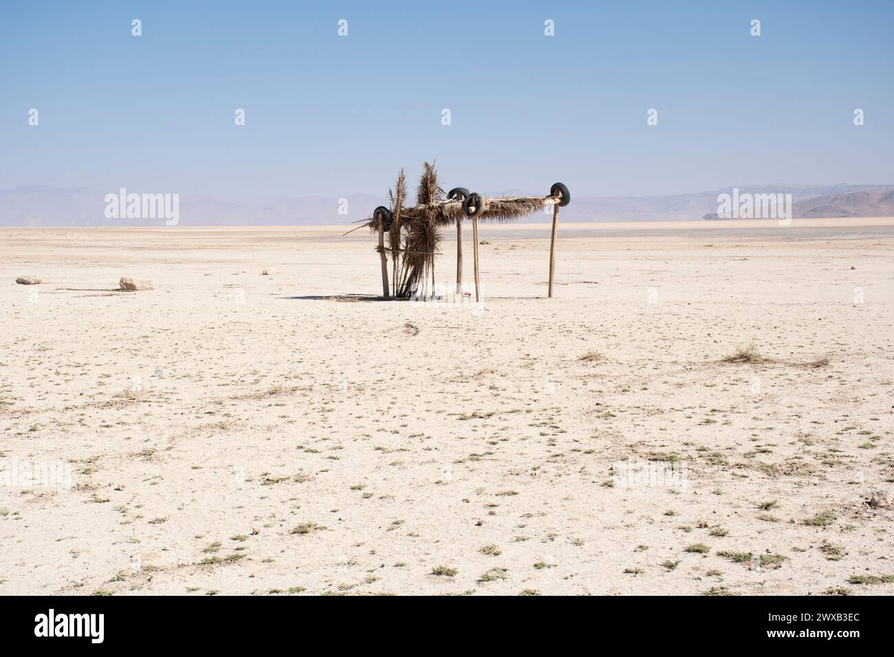 Dried up salt lake in summer and pink salt pools in Maharlu region near ...