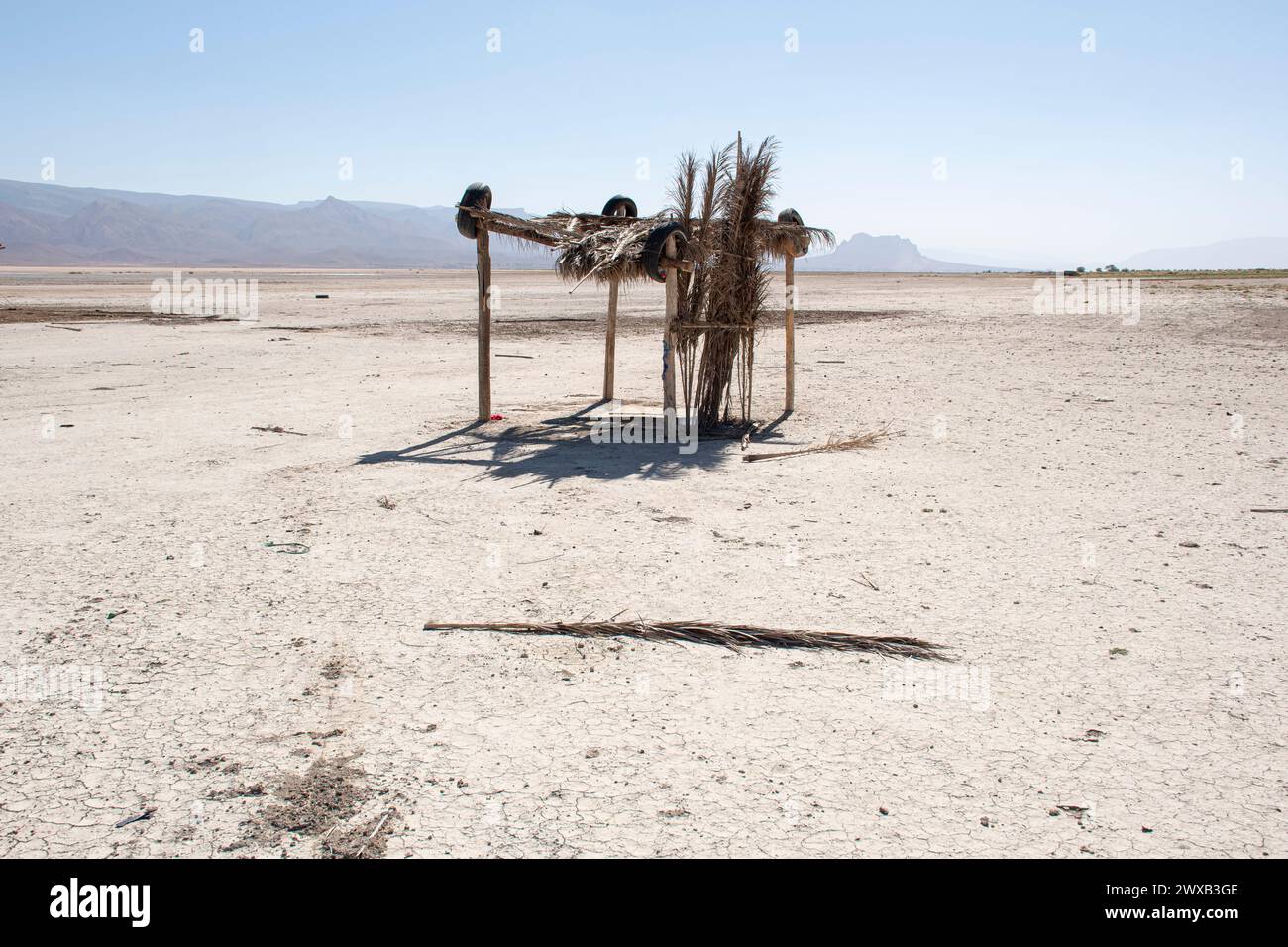 Dried up salt lake in summer and pink salt pools in Maharlu region near ...
