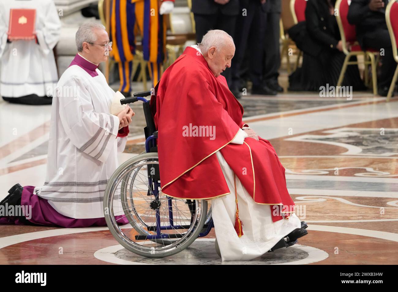 Pope Francis, with master of ceremonies Diego Ravelli, left, arrives ...