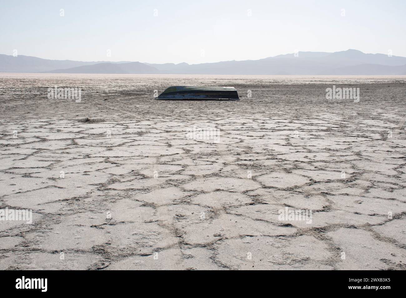 Dried up salt lake in summer and pink salt pools in Maharlu region near ...
