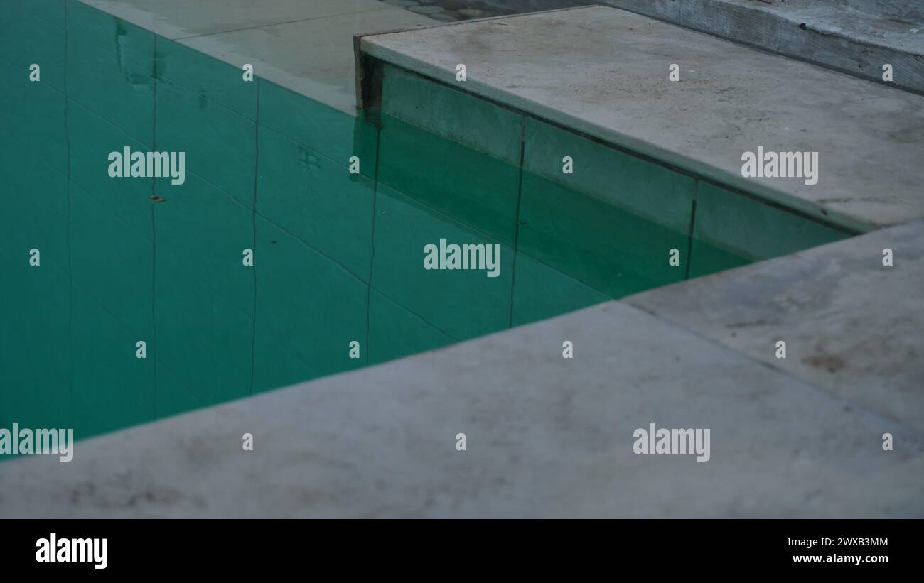 Corner swimming pool with turquoise water Stock Photo - Alamy