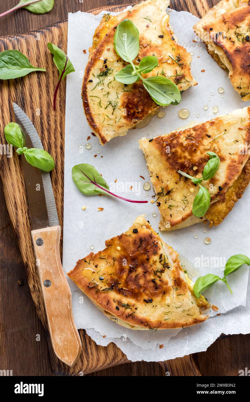 Homemade naan bread breakfast sandwiches with herbs and honey Stock ...
