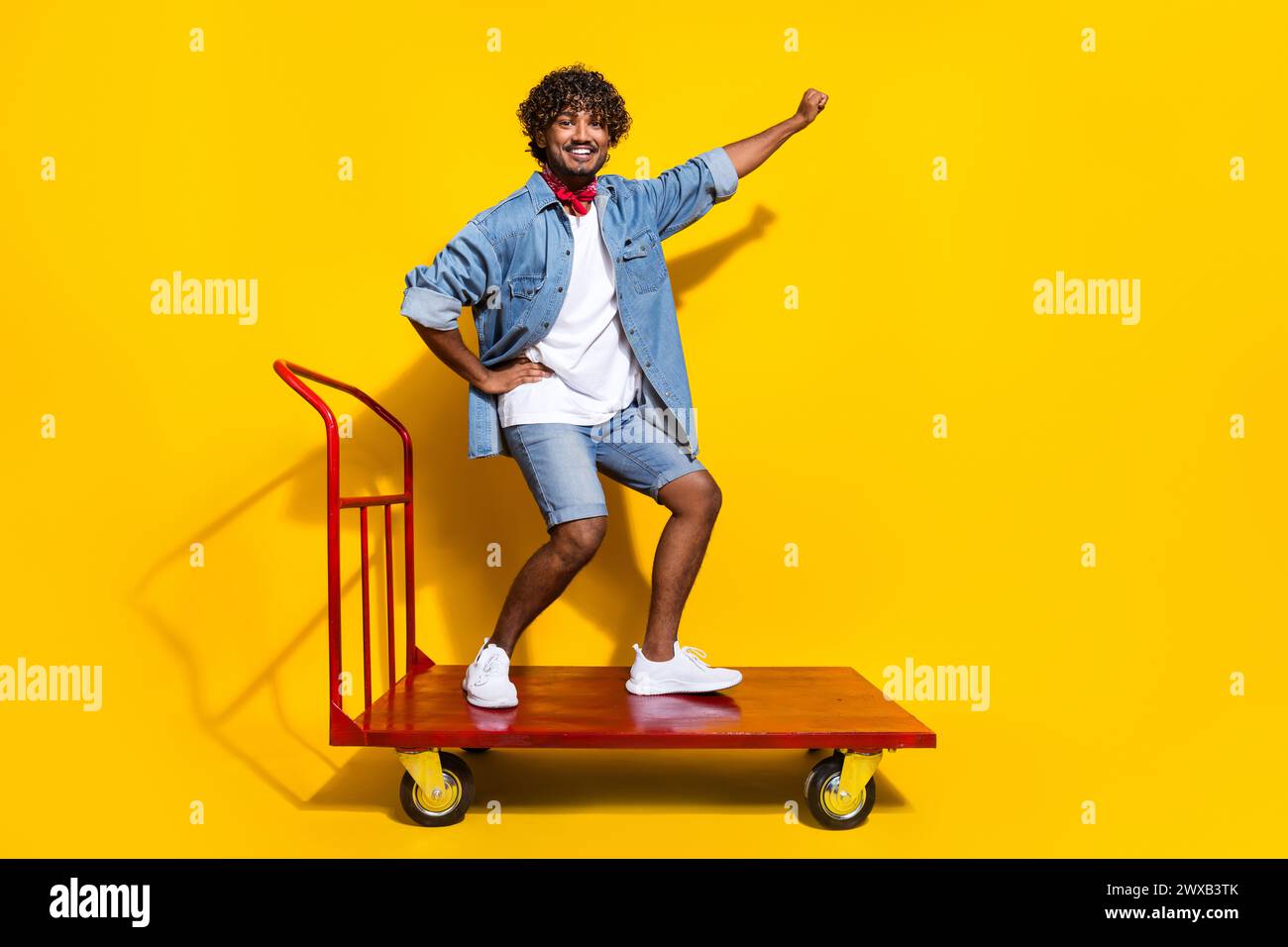 Full length photo of handsome young guy riding cart warehouse wear ...