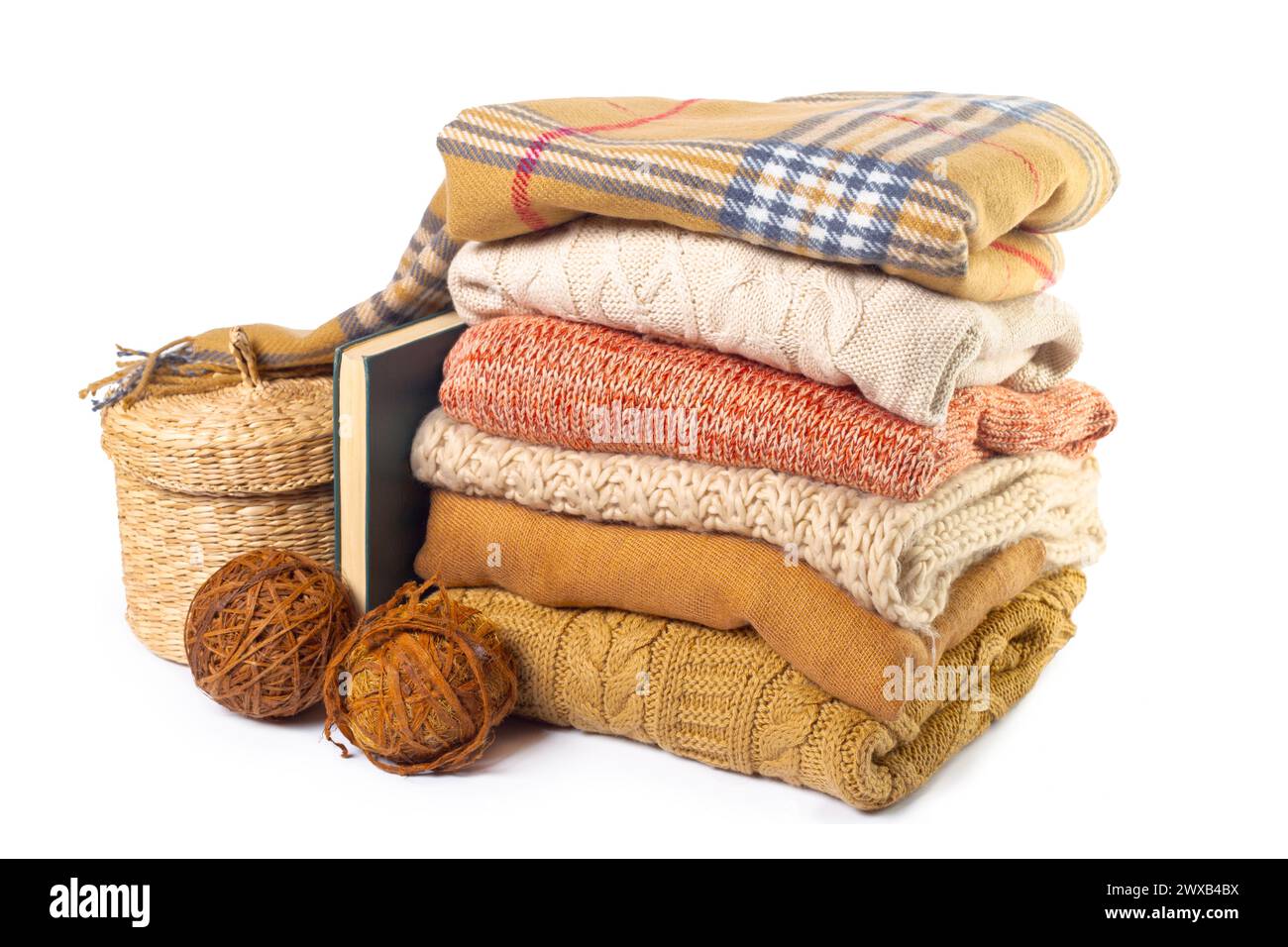 Stack of various sweaters isolated on white background Stock Photo - Alamy
