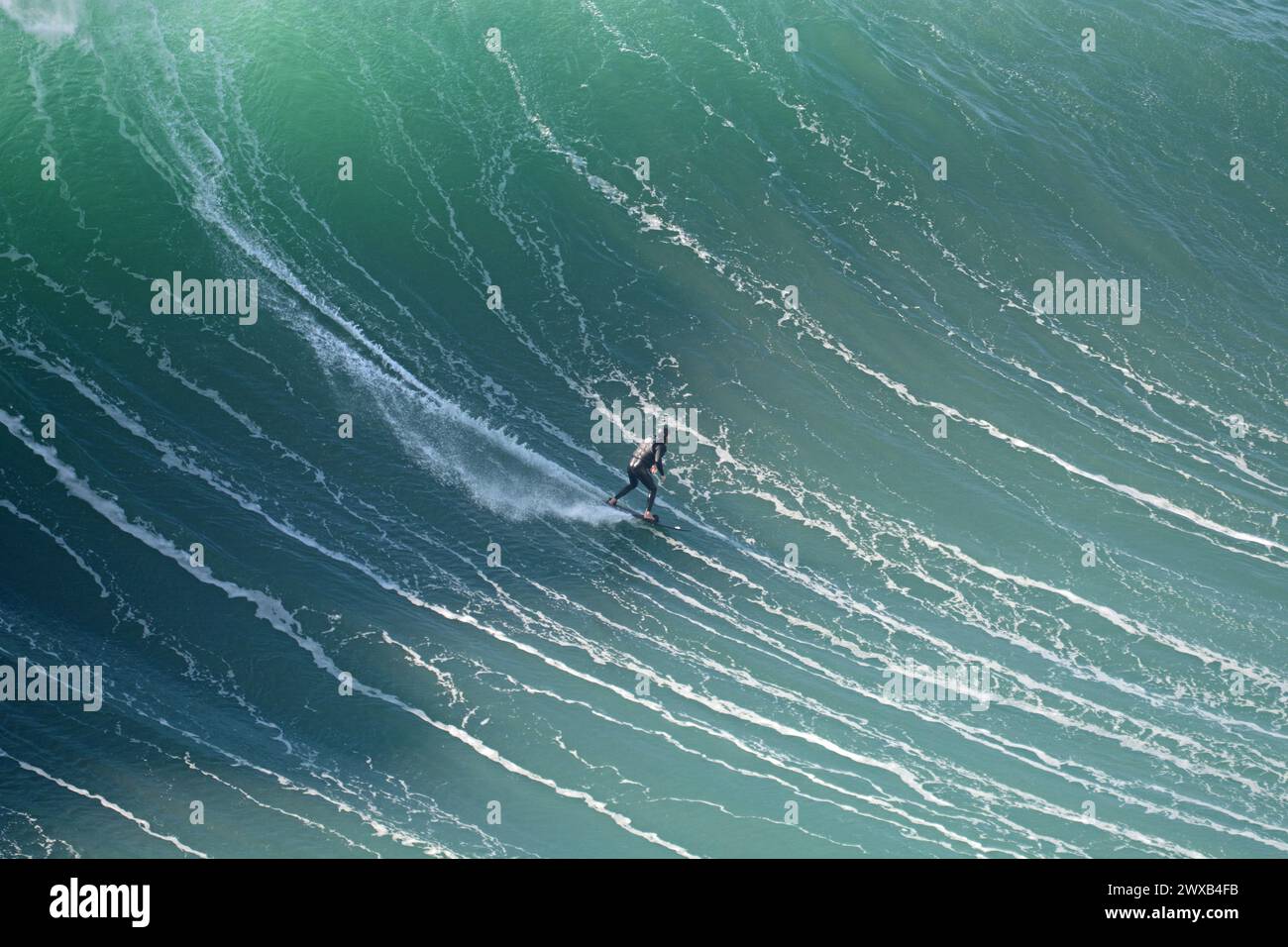 Nazare portugal big wave surfer hi-res stock photography and images - Alamy