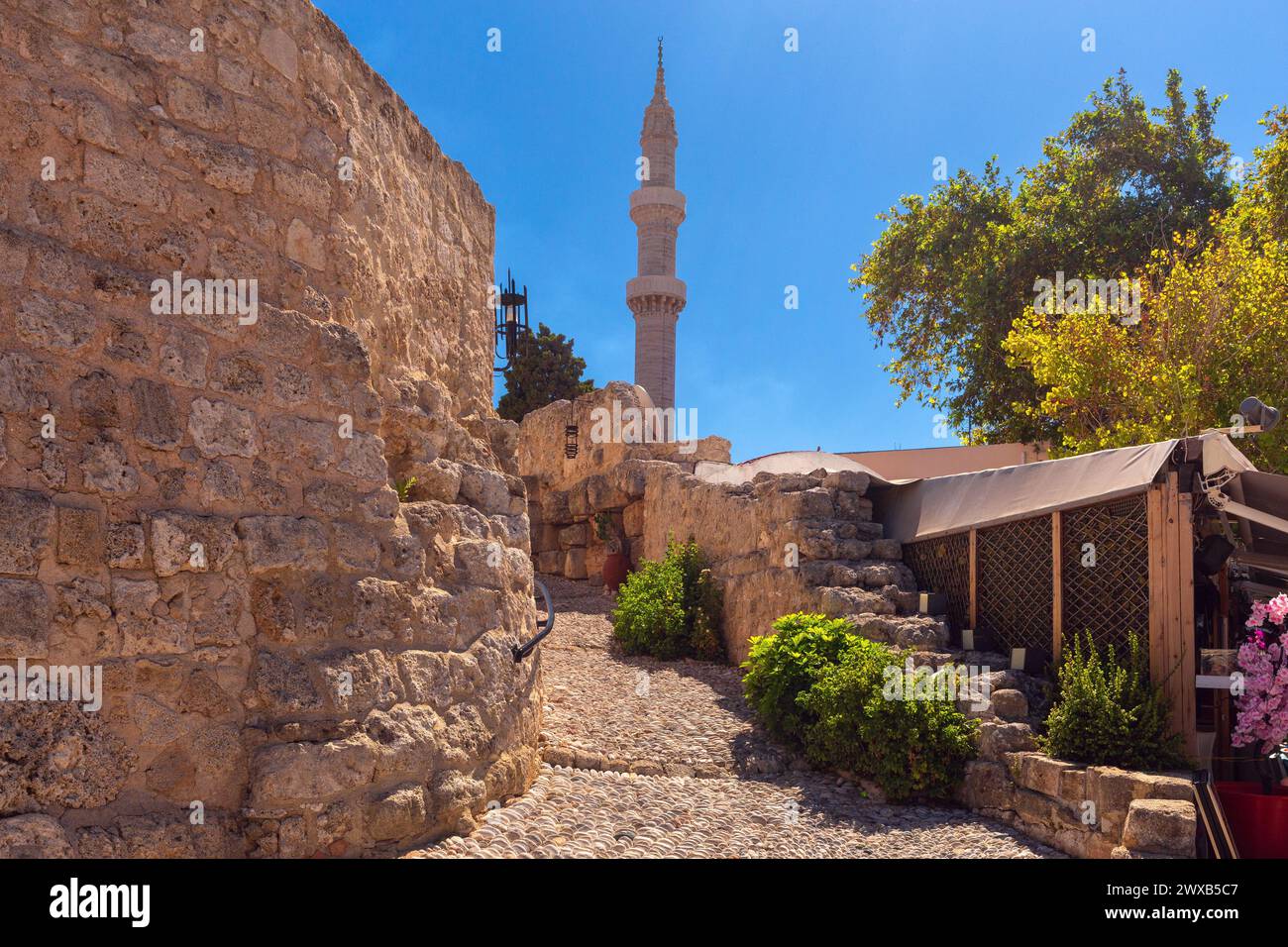 Pink medieval Ottoman Suleiman Mosque in the fortress of Rhodes. Greece ...