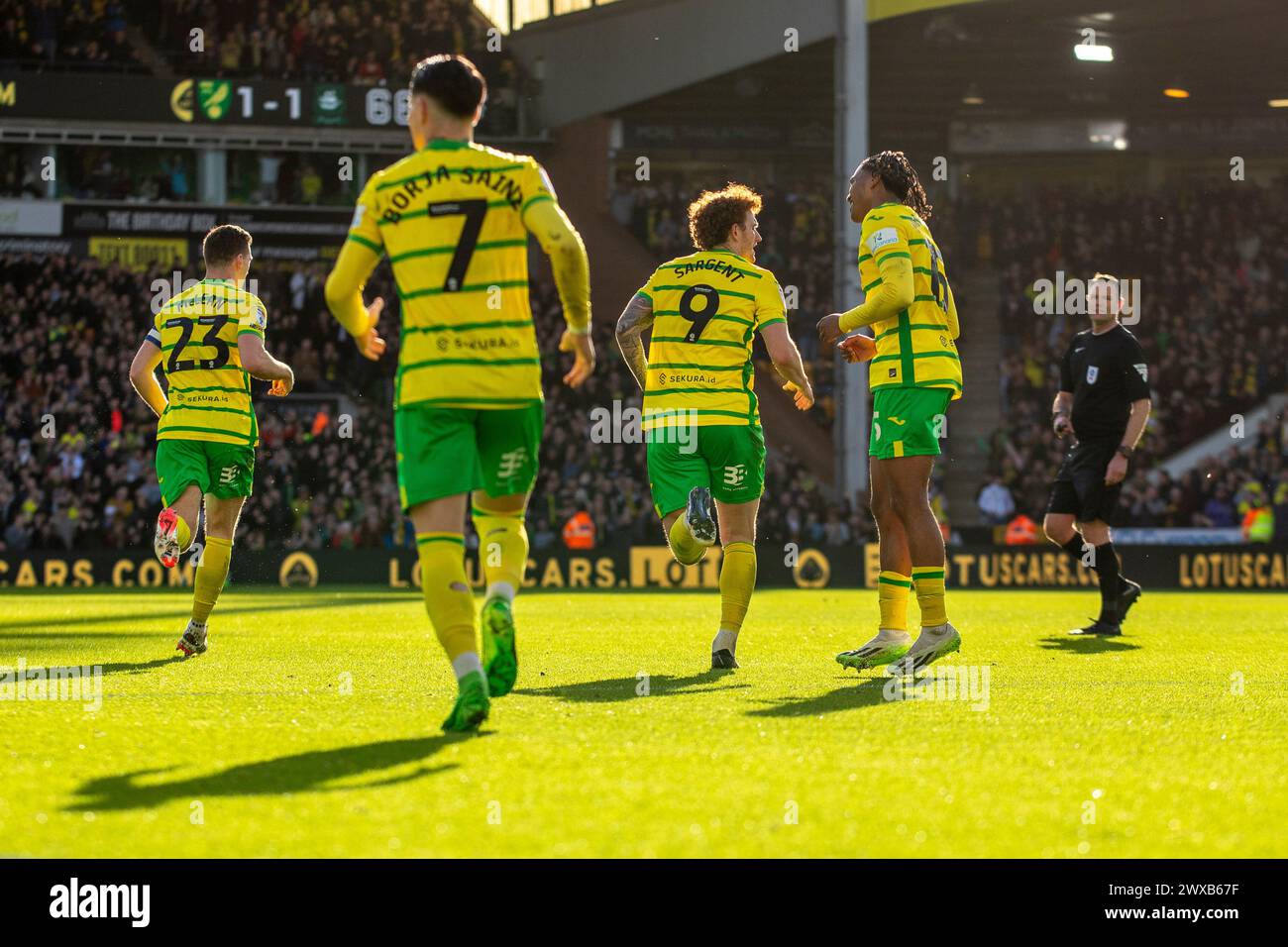 Josh Sargent of Norwich City is congratulated by Sam McCallum of ...
