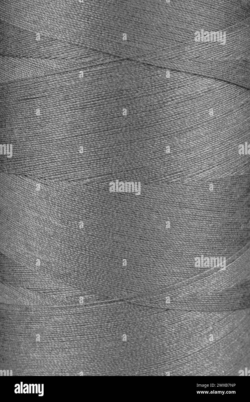 Texture of gray color threads in spool close up, macro. Sewing threads ...