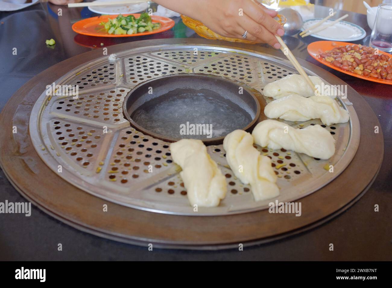 It's a traditional Chinese stove hot pot that is commonly used in the ...