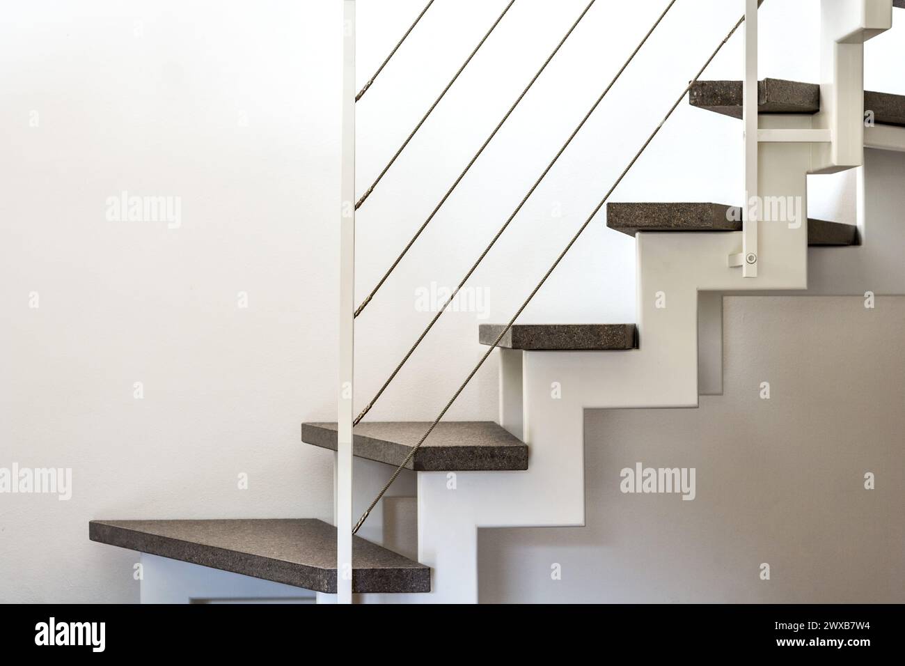 internal home staircase with metal structure, porphyry steps and white ...