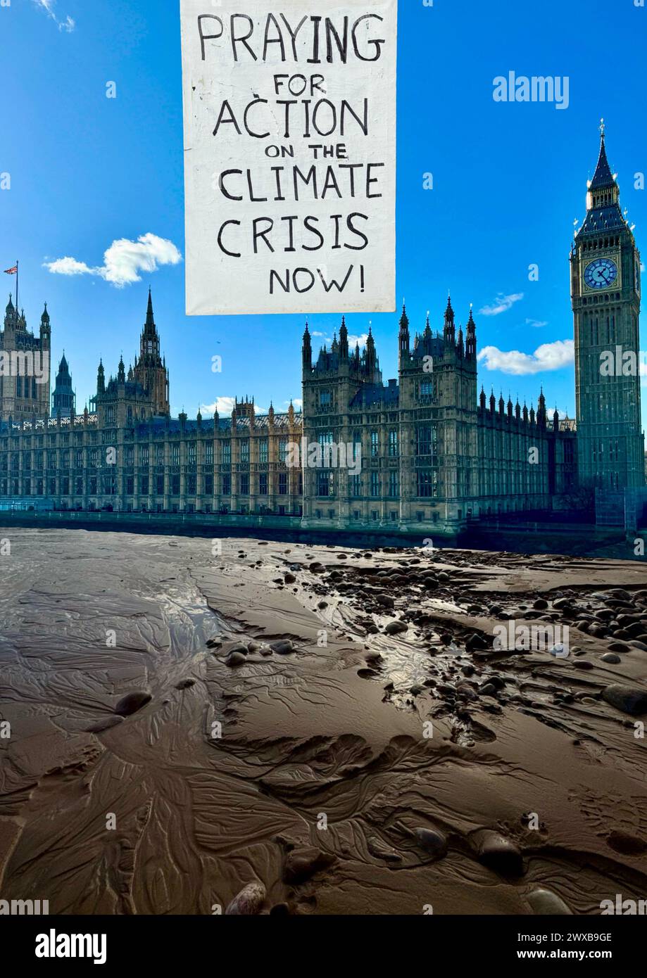 Praying for action on the climate crisis sign .This sign is on display ...