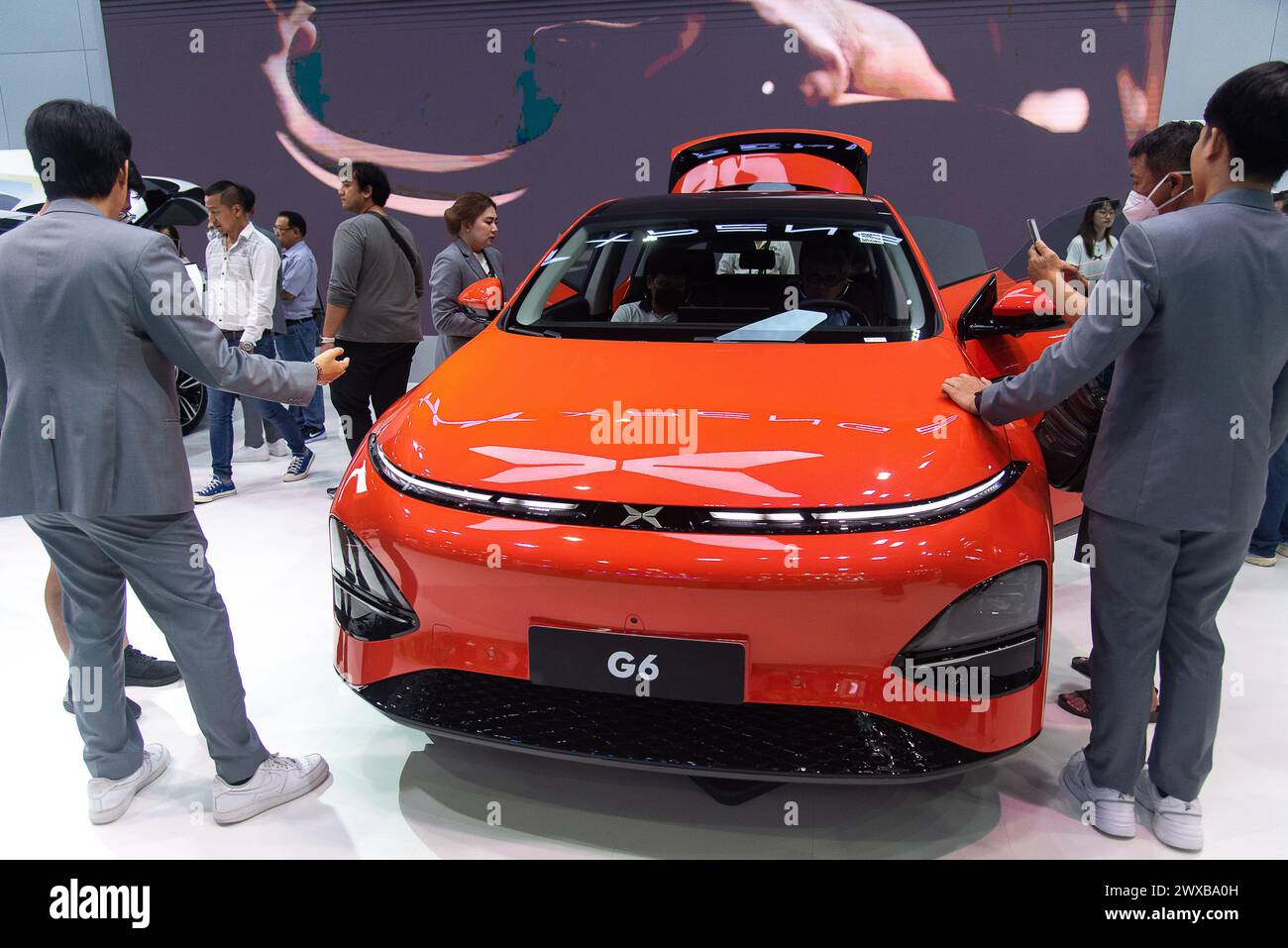 Bangkok, Thailand. 29th Mar, 2024. Visitors inspect a Xpeng G6 car ...