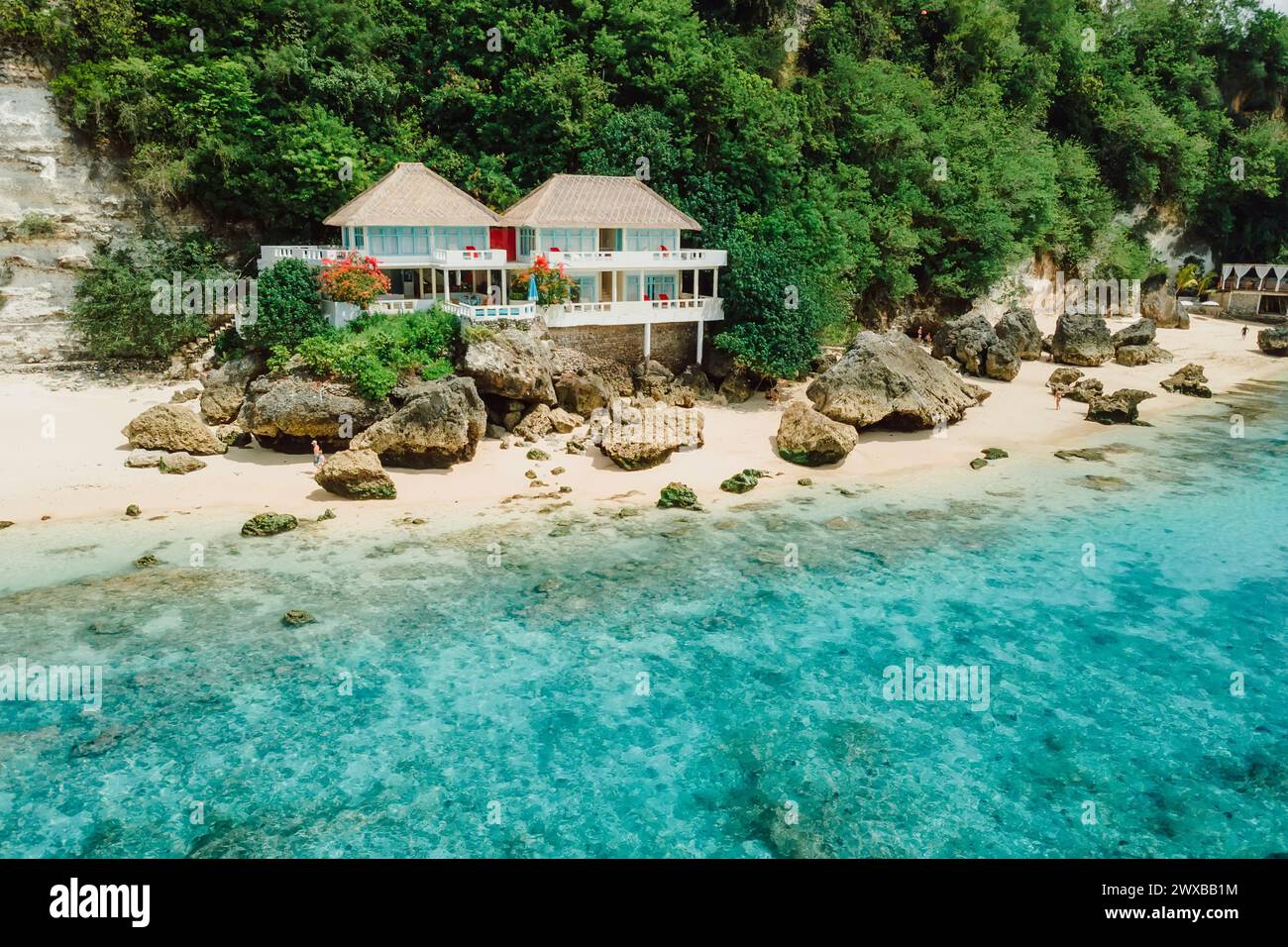 Aerial view of coastline with cozy hotel resort and quiet ocean on ...