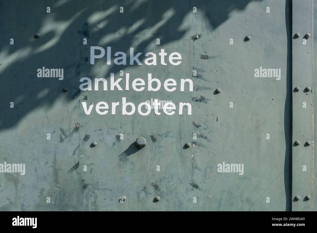 Metal gate with lettering, sticking up posters prohibited Stock Photo ...