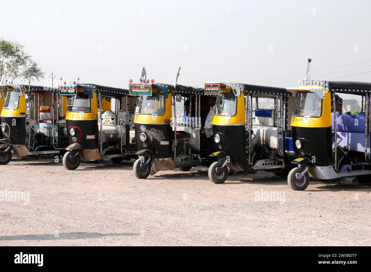 Row of parked auto rickshaws in different colours, Rajasthan, North ...